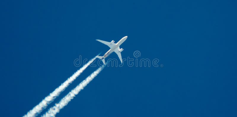 Airplane with contrail stock photo. Image of vacation - 145016540