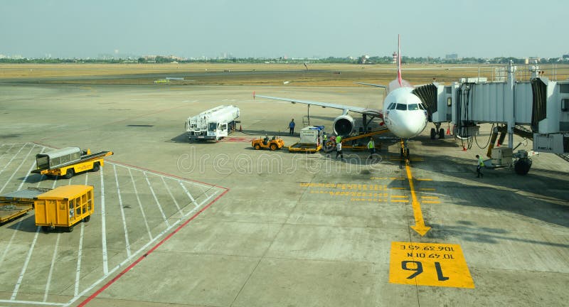 Airplane Docking at the Airport in Bali, Indonesia Editorial Stock ...