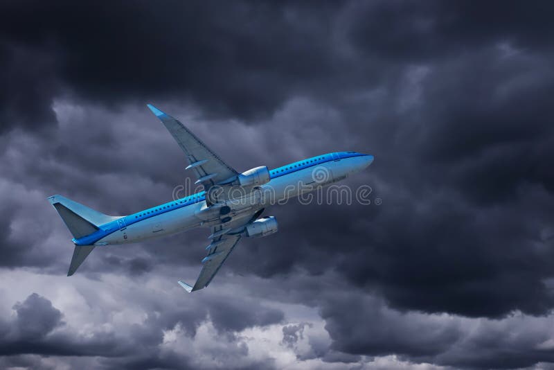 Airplane with dramatic sky stock photo. Image of high - 124065946