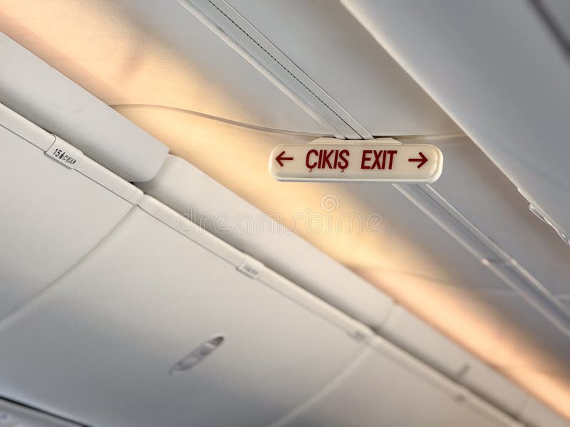 Airplane Exit Sign with Bilingual Marking. Safety, Navigation, and ...