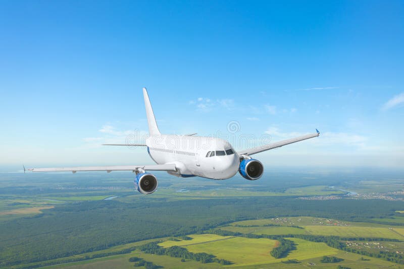 Airplane Flies Over Earth`s Surface Under the Blue Sky Stock Image ...