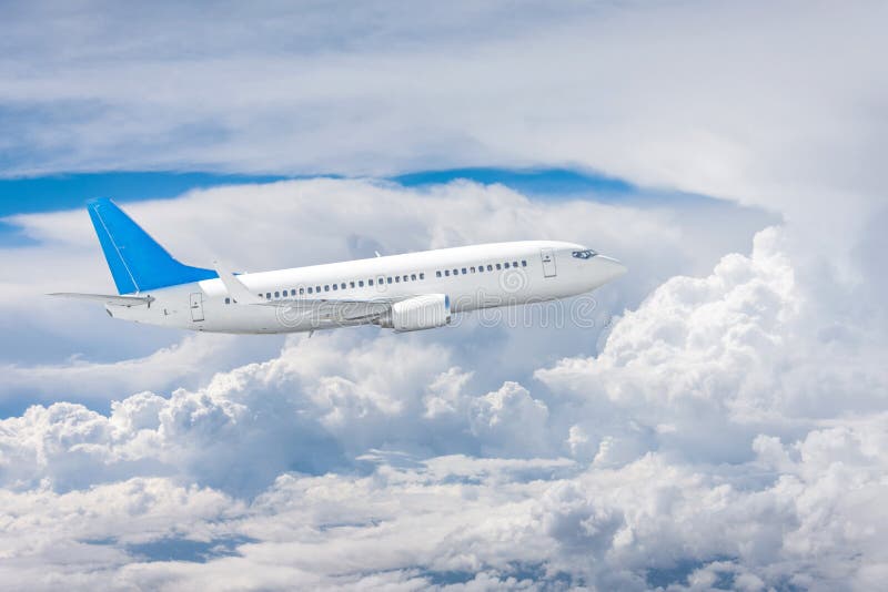Airplane Flies among the Powerful Summer Clouds Stock Image - Image of ...