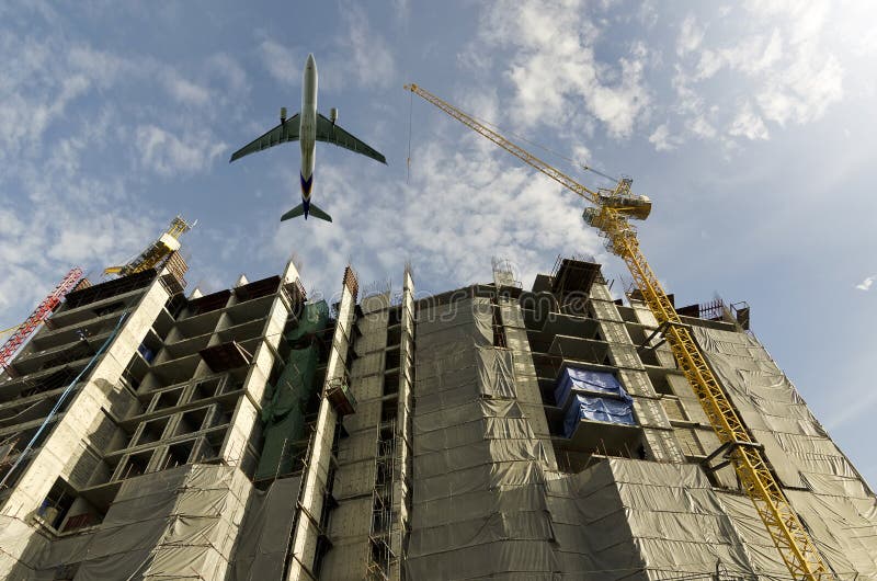 Airplane Fly Over the Building Stock Photo - Image of construction ...