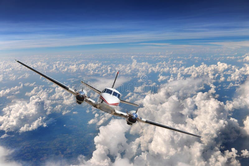 Airplane Flying Above the Clouds Stock Photo - Image of cumulus, turbo ...