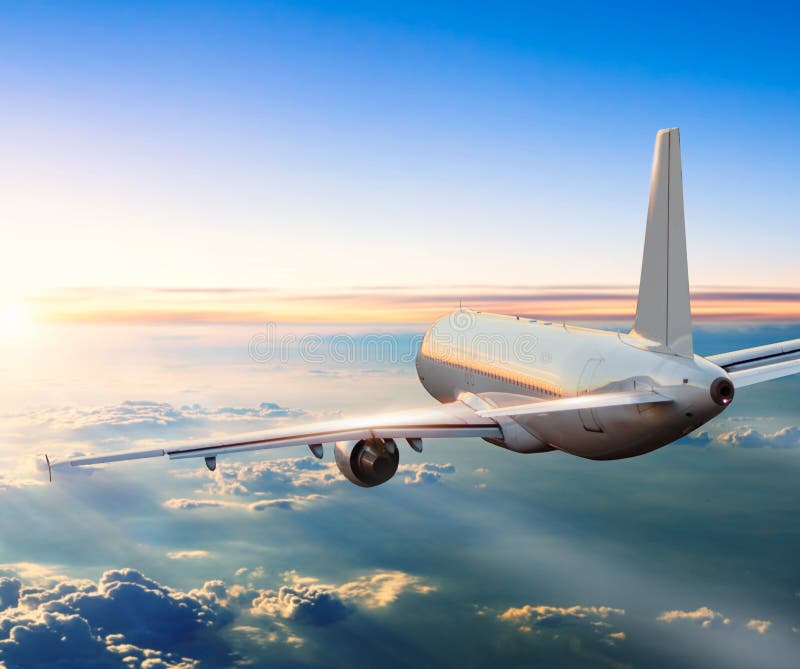 Airplane Flying Above Clouds in Dramatic Sunset Stock Image - Image of ...