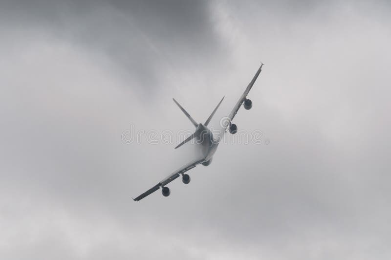 Airplane Flying in Bad Weather Stock Photo - Image of flight, clouds ...