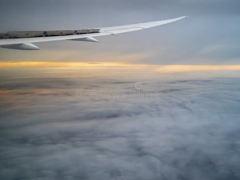 Airplane Flying between Cloud Layers Viewed from Passenger Cabin Window Stock Photo - Image of ...