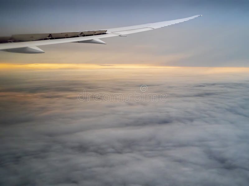 Airplane Flying between Cloud Layers Viewed from Passenger Cabin Window ...