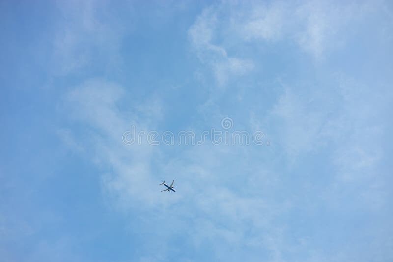 Airplane Flying in the Cloudy Blue Sky, Bottom View Stock Image - Image ...
