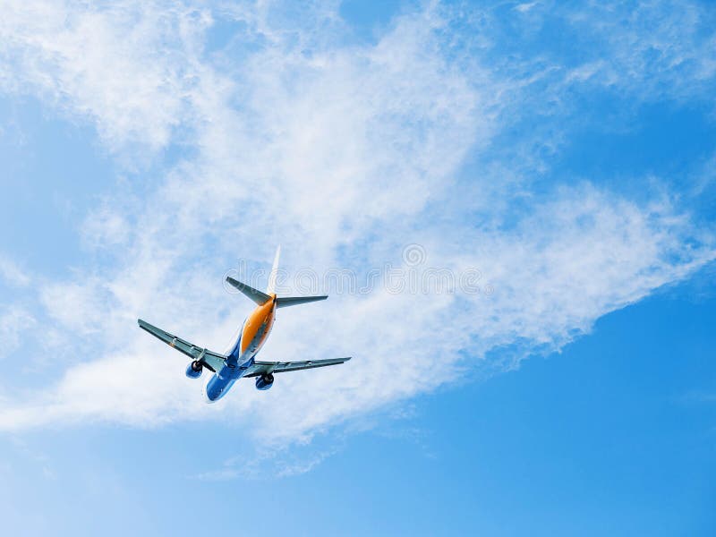 Airplane Flying in the Cloudy Blue Sky, Bottom View Stock Image - Image ...