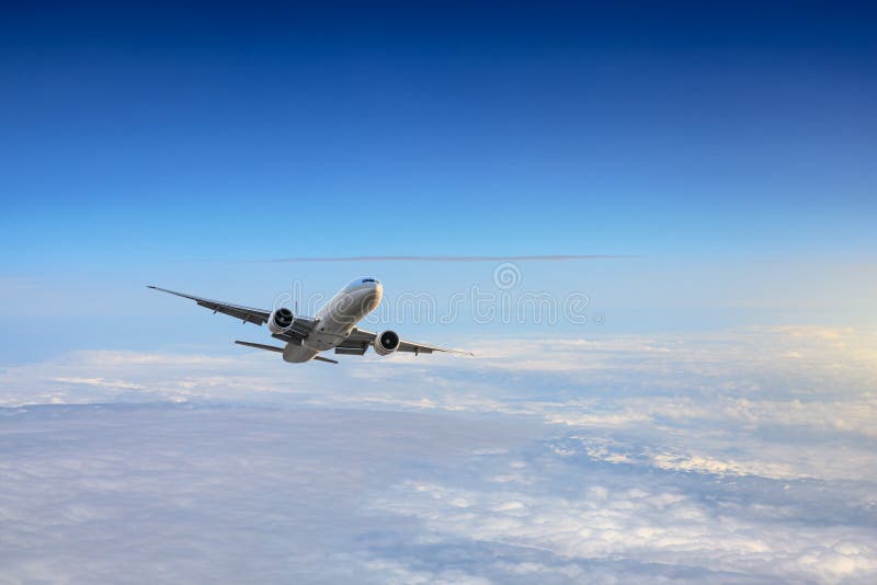 Airplane Flying at High Altitude and Beautiful High-altitude Clouds ...