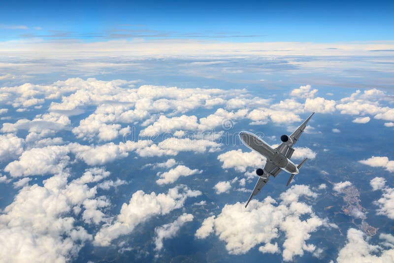 Airplane Flying at High Altitude and Beautiful High-altitude Clouds ...