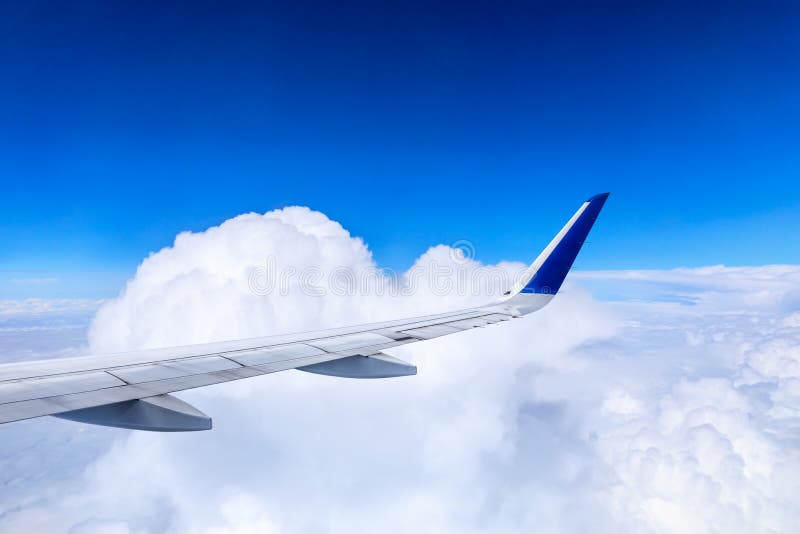 Airplane Flying at High Altitude and Beautiful High-altitude Clouds ...