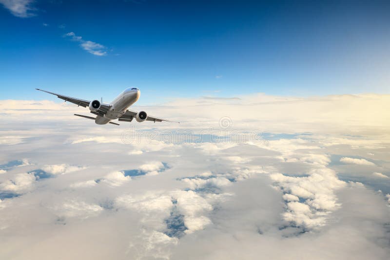Airplane Flying at High Altitude and Beautiful High-altitude Clouds ...