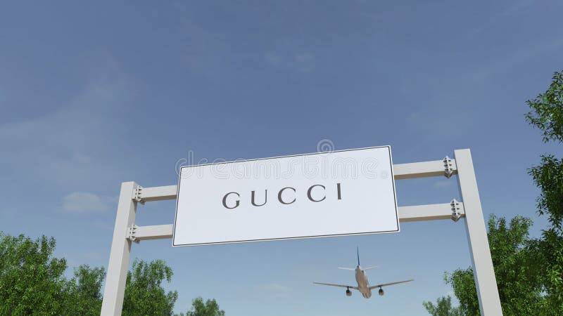 Airplane Flying Over Advertising Billboard with Gucci Logo. Editorial ...