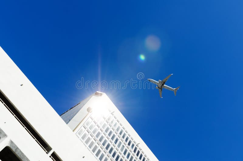 Airplane Flying Over the Building Stock Image - Image of building ...