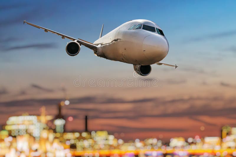 Airplane is Flying Over City at Sunset Stock Photo - Image of urban ...