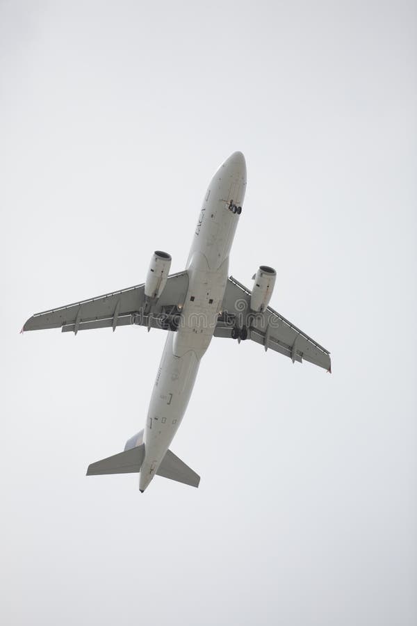 Airplane flying over head stock photo. Image of fuselage - 24812484