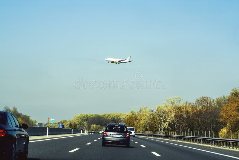 Airplane Flying Over Highway Road.the Plane Flies Over the Road ...