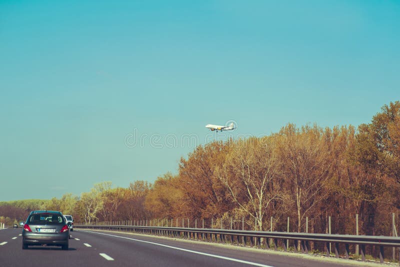 Airplane Flying Over Highway Road.the Plane Flies Over the Road. Stock ...