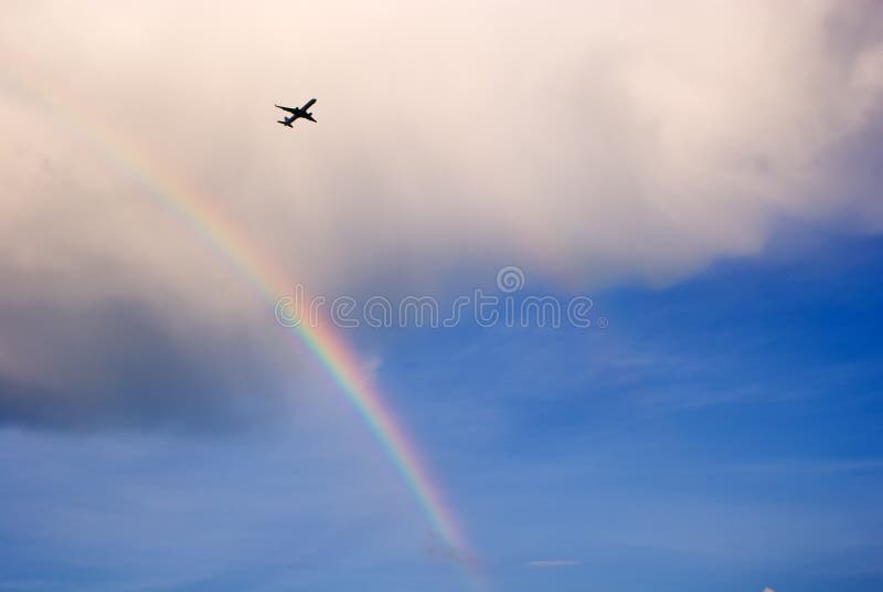 Airplane Flying Over Rainbow Stock Photo - Image of flying, cloudscape ...