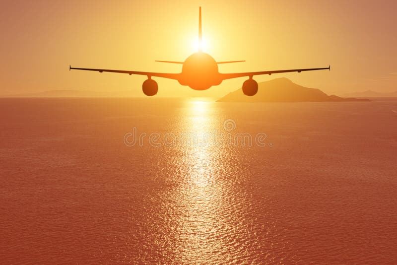 Airplane Flying Over the Sea at Sunset. Travel Concept Stock Image ...