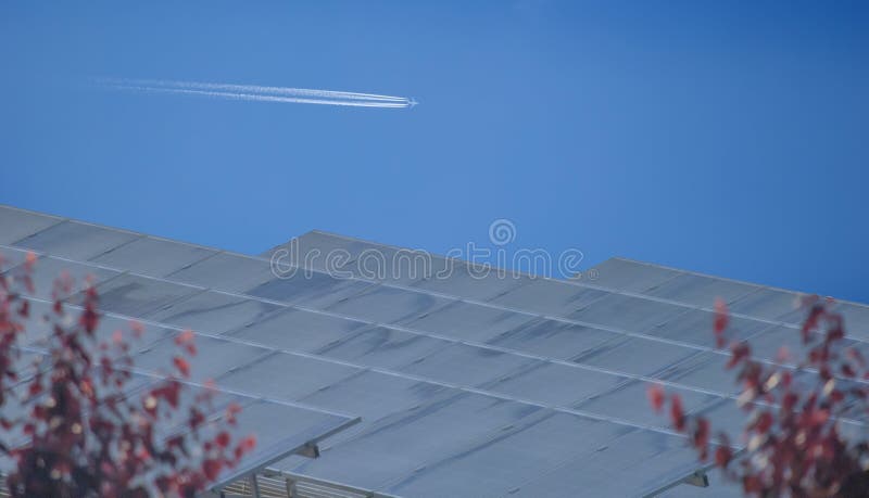 Airplane Flying Over the Solar Panels in the Blue Sky Stock Image ...