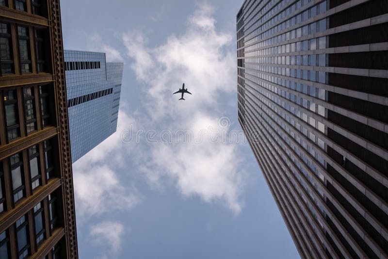 Airplane Flying Overhead in Downtown Chicago in the Middle of Two ...