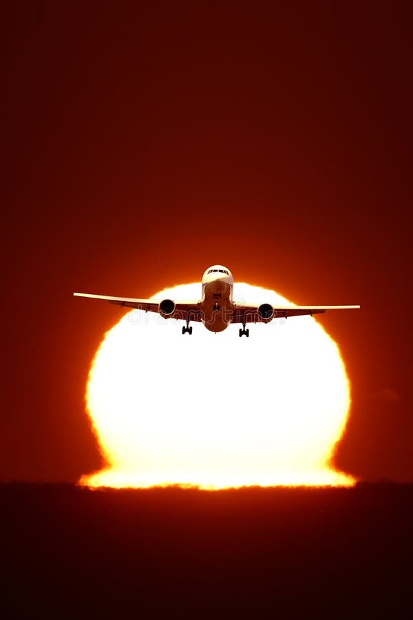 An Airplane Flying in the Sun Stock Image - Image of cargo, sunrise ...