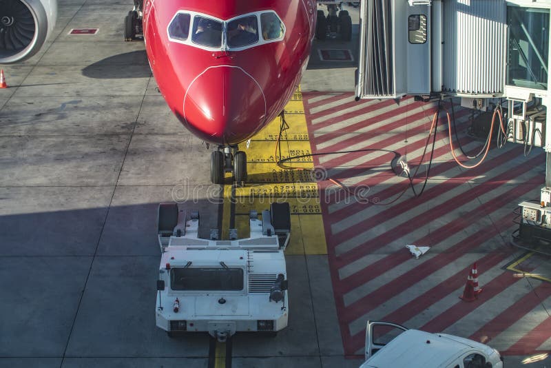 Airplane Arriving at at the Gate Editorial Photography - Image of cone ...