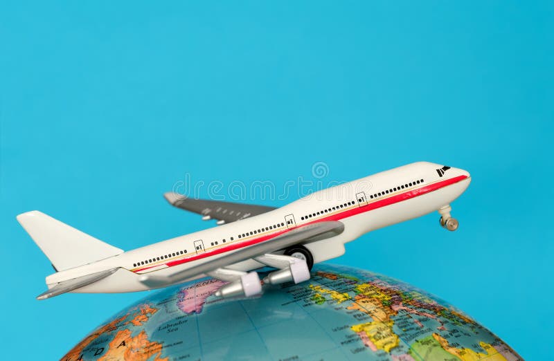 Airplane on Globe. Blue Background. Flight Around the World Stock Photo ...