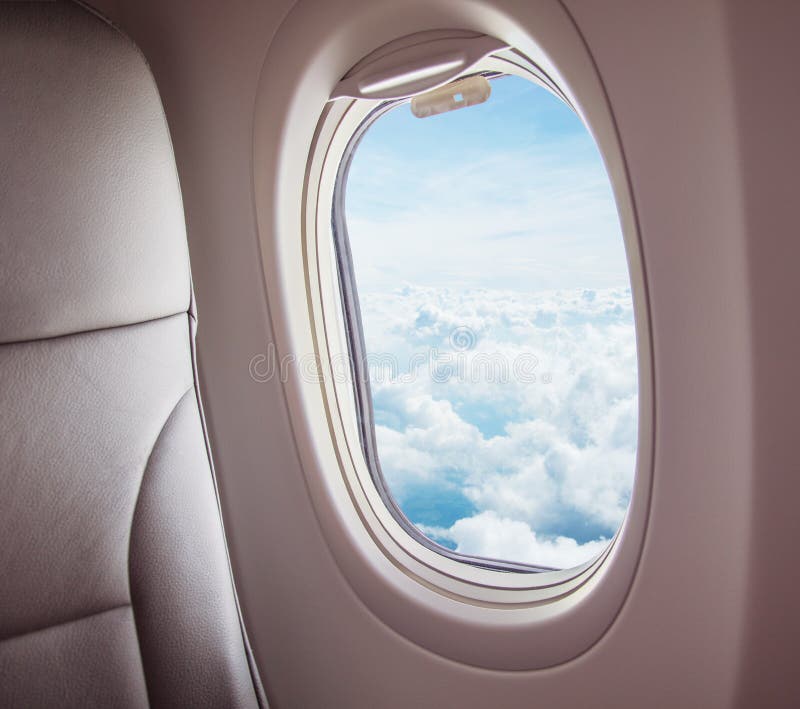 Airplane Interior with Window View of Clouds Stock Image - Image of ...