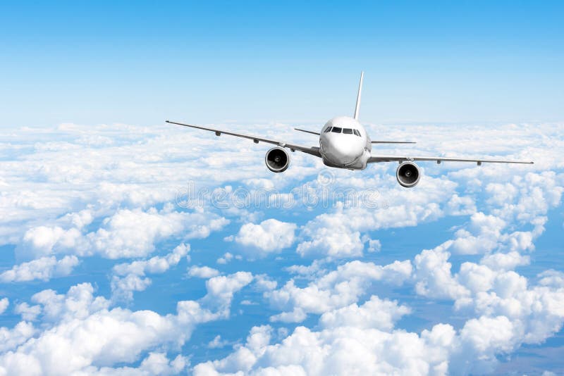 Airplane Jet Flying at Flight Level High in the Sky Above the Clouds ...