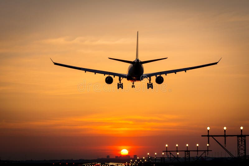Airplane is Landing during Sunrise. Stock Image - Image of dusk, light ...