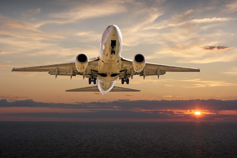 Airplane Landing at Sunset stock photo. Image of sunset - 21125926