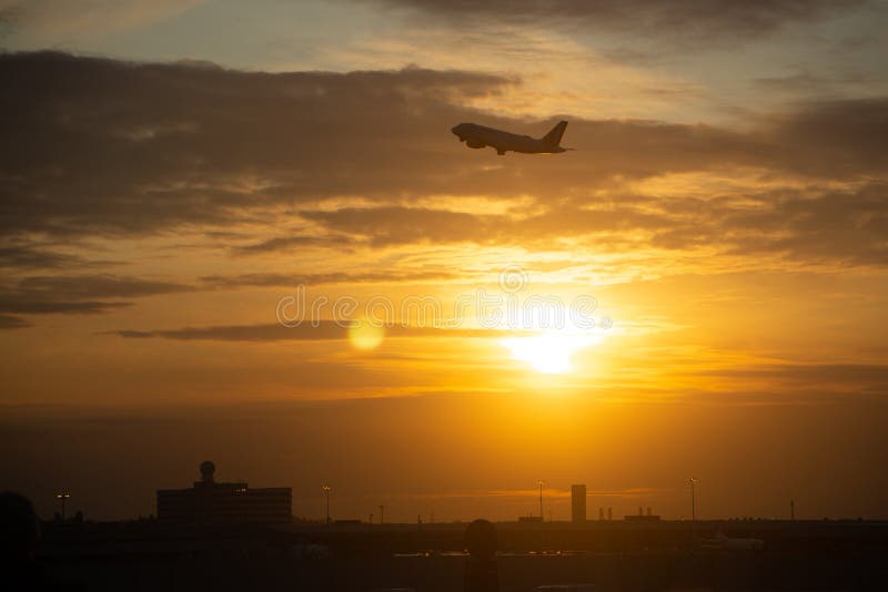 Airplane Lifting Over a Dramatic Sunset Editorial Photography - Image ...
