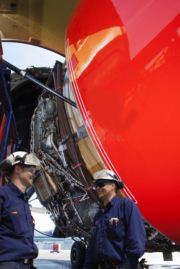 Airplane Mechanics and Jumbo Jet Engine Stock Image - Image of ...