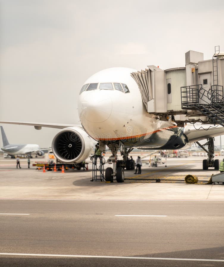 Airplane Near the Terminal in an Airport Stock Image - Image of ...