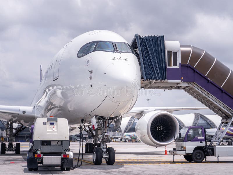 Airplane Near the Terminal in an Airport Stock Photo - Image of airport ...