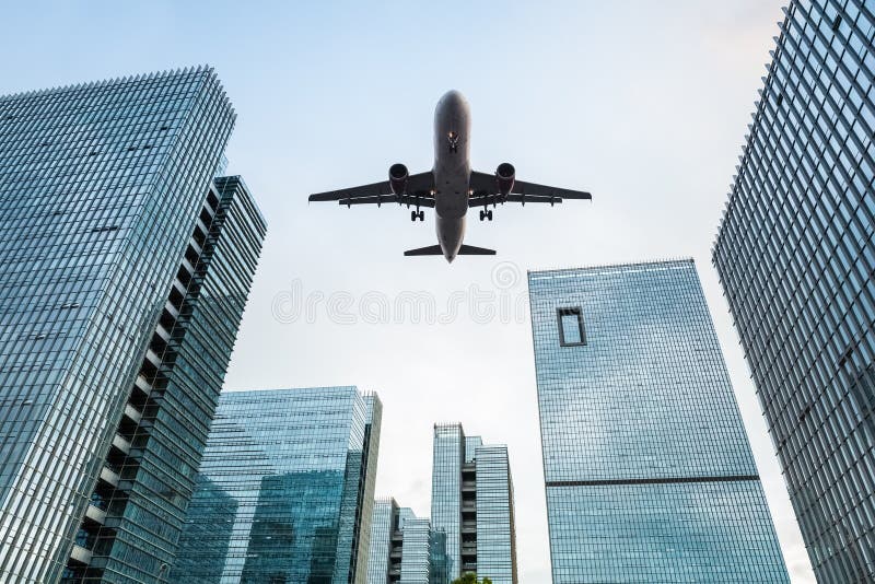 Airplane and Office Buildings Stock Photo - Image of airliner, future ...