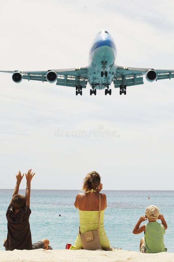 Airplane over the beach editorial photography. Image of people - 16294972