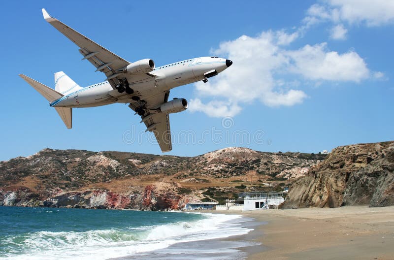 Airplane over the beach stock photo. Image of aircraft - 38076540