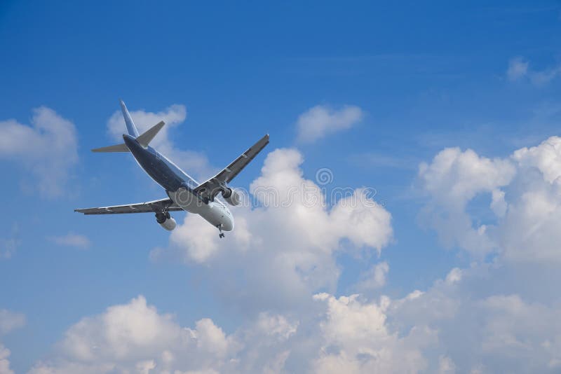Airplane over the clouds stock photo. Image of clear - 146910108