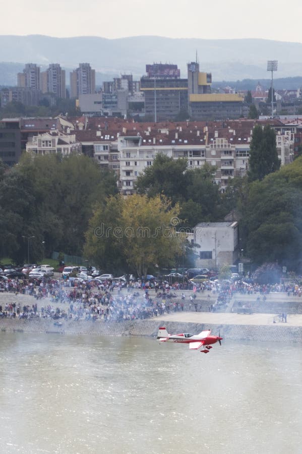 Airplane over crowds stock image. Image of people, river - 119695163
