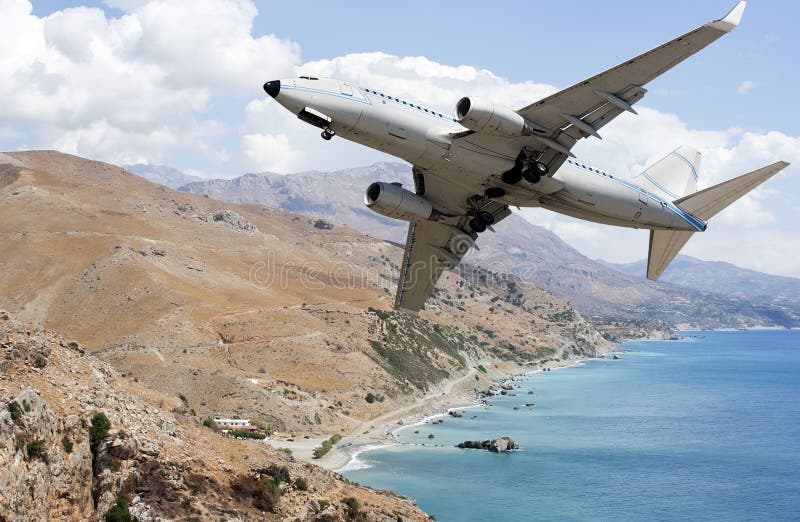 Airplane over mountains stock photo. Image of greek, clouds - 38076572