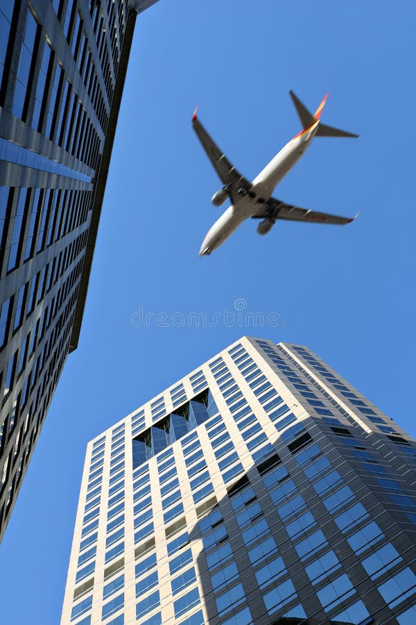 Airplane Over Office Building Stock Photo - Image of land, china: 4148724