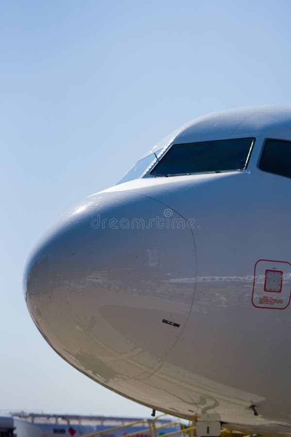 Airplane parked in airport editorial photography. Image of aeroplane ...