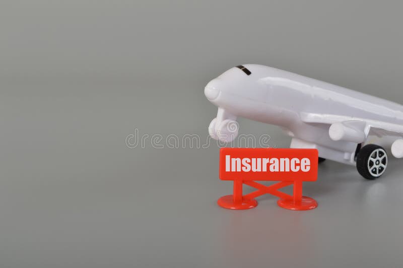 Airplane and Plastic Board with Text INSURANCE.Concept of Travel ...