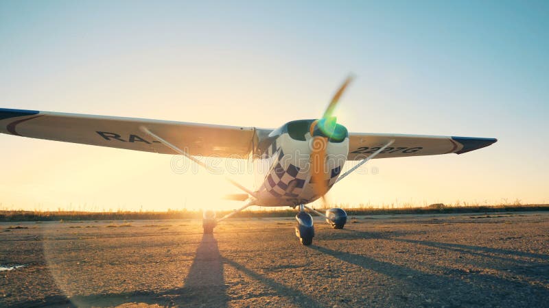 Airplane with Rotating Propeller. Working Plane Standing on a Runway ...