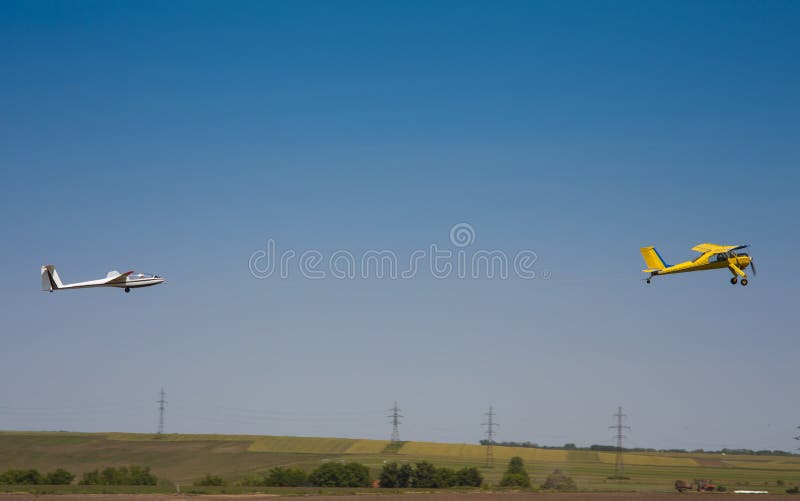 Airplane pulling glider stock photo. Image of flying - 117807670